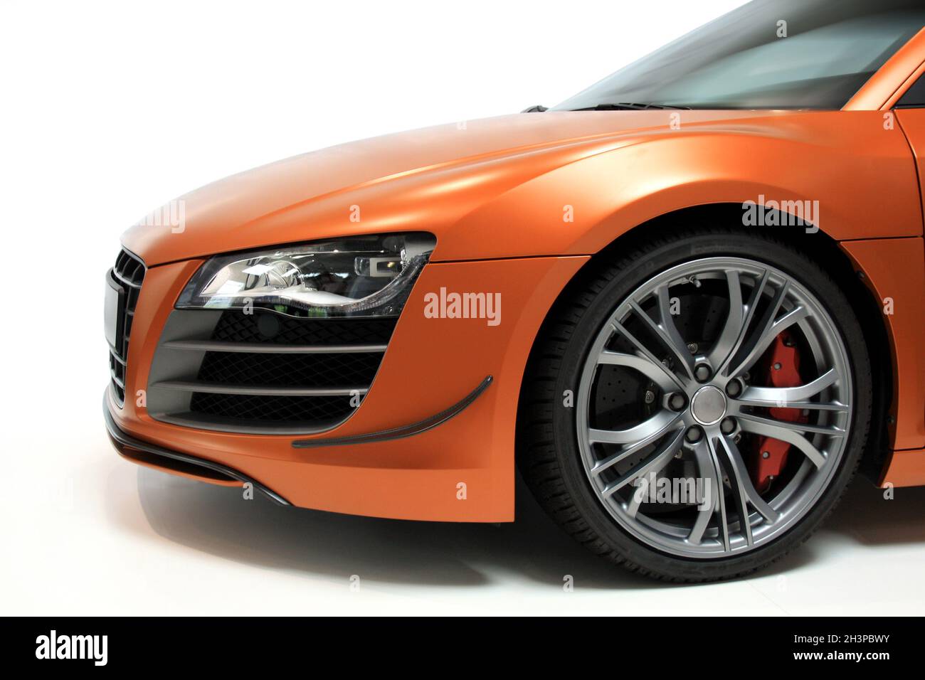 Fast luxury sporty red and orange car Stock Photo - Alamy