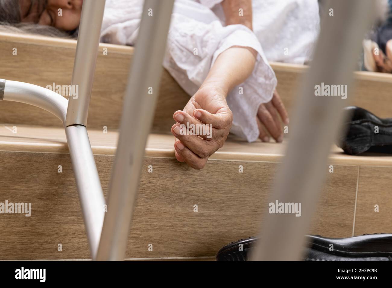 Elderly woman with walker falling down stair Stock Photo - Alamy