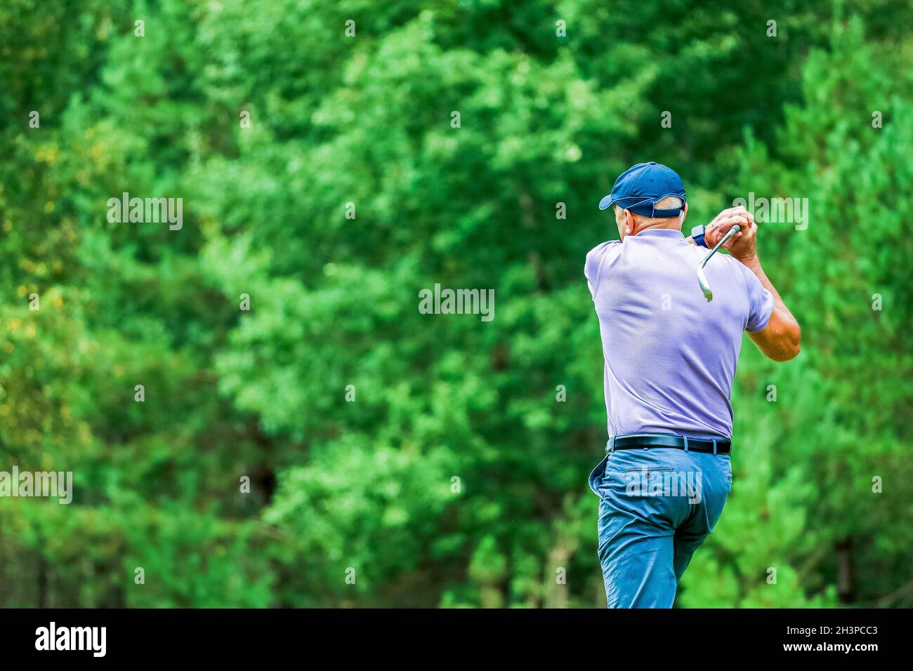 Playing golf back swing hi-res stock photography and images - Alamy