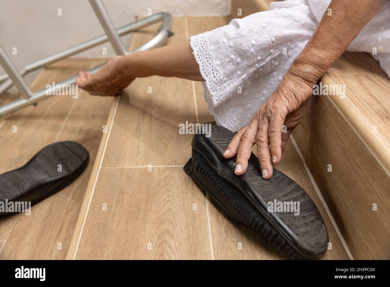 Elderly woman with walker falling down stair Stock Photo - Alamy