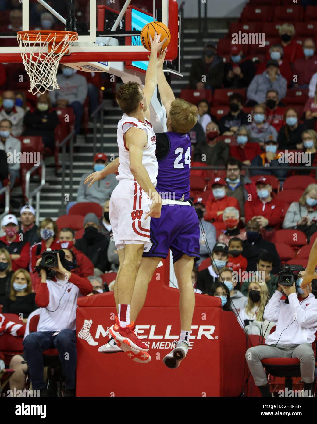 October 29, 2021: Wisconsin Badgers forward Tyler Wahl (5) with a block ...