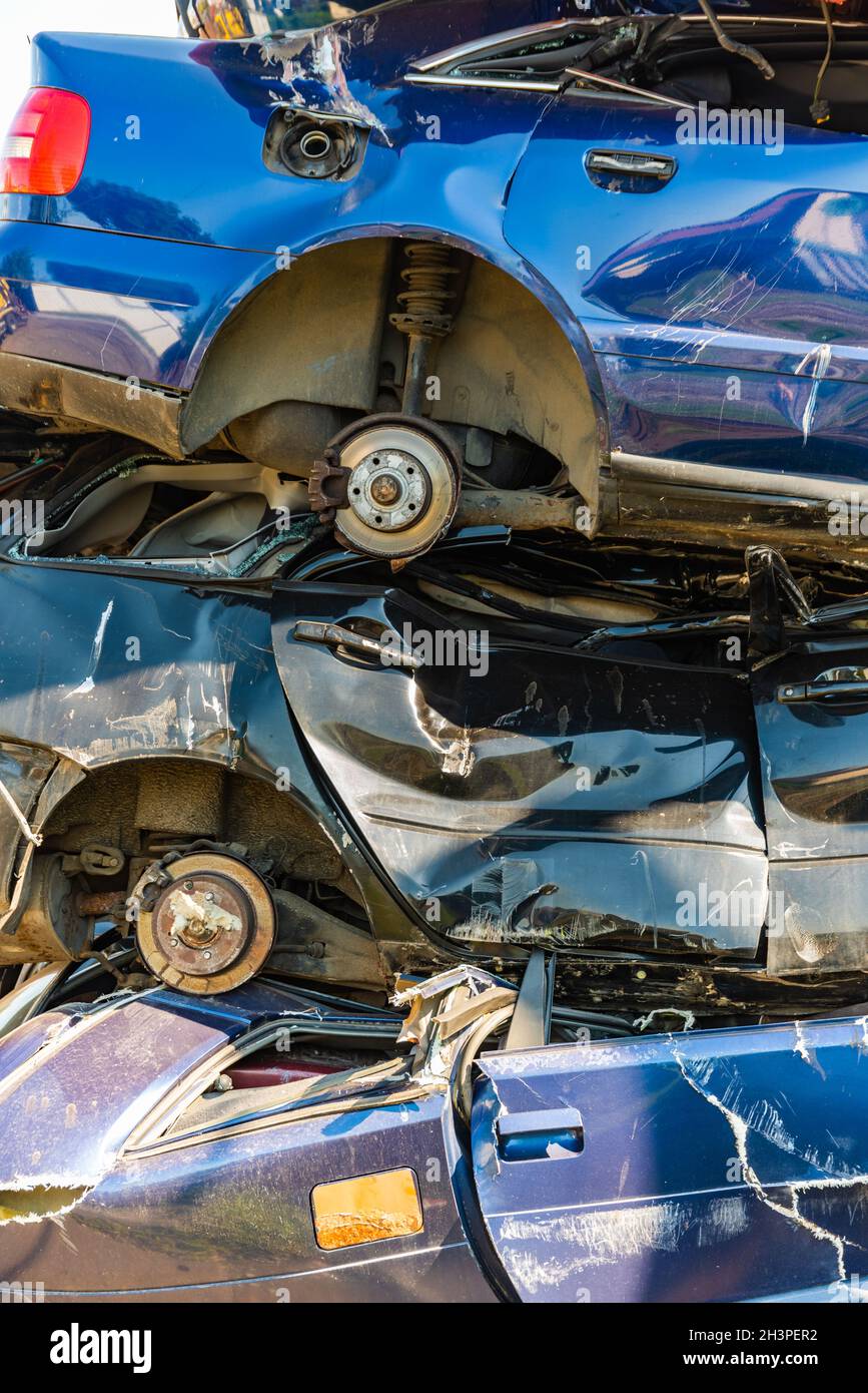 Stacked crushed cars going to be shredded in a recycling facility Stock ...