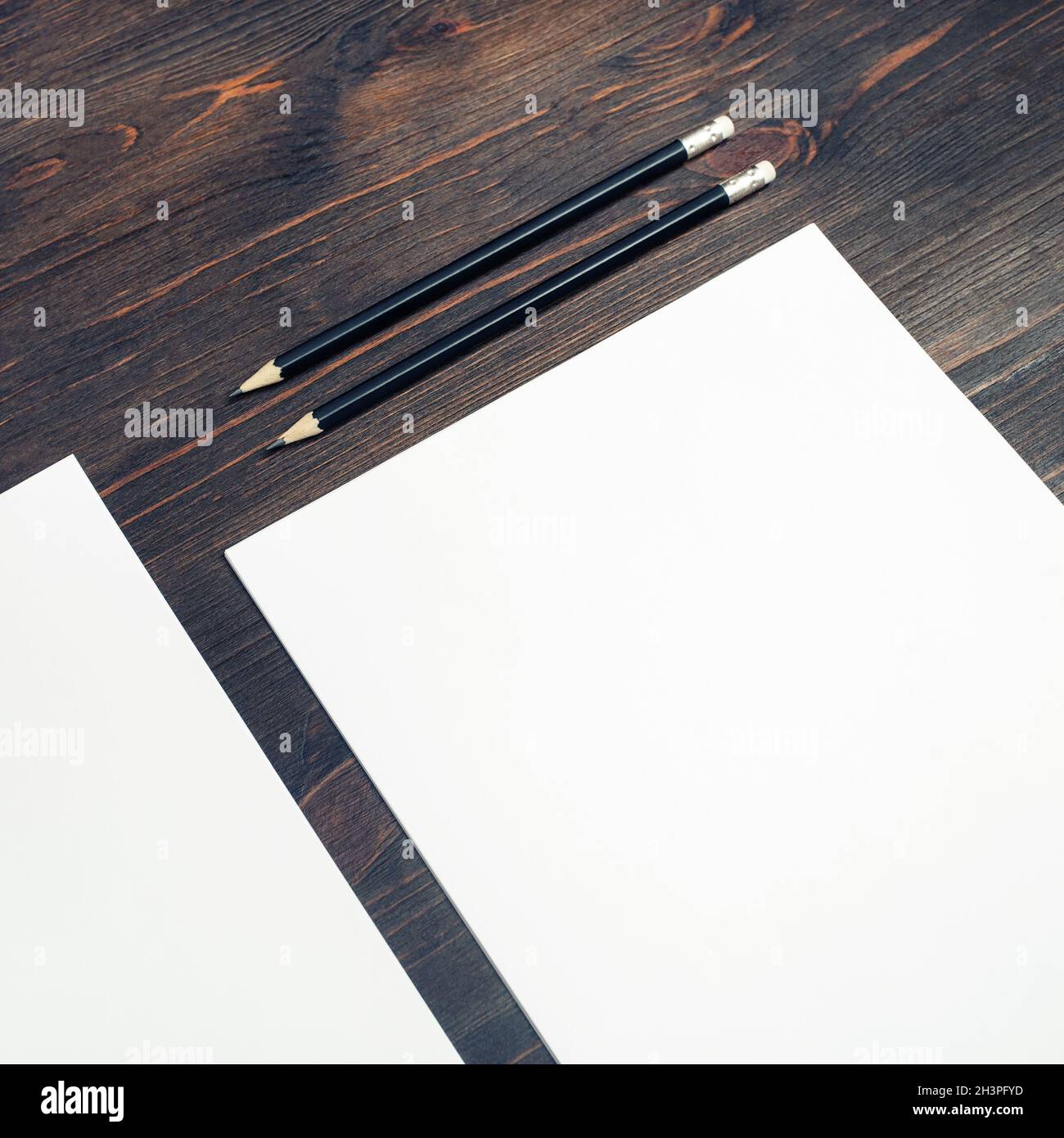 Paper and pencils Stock Photo - Alamy