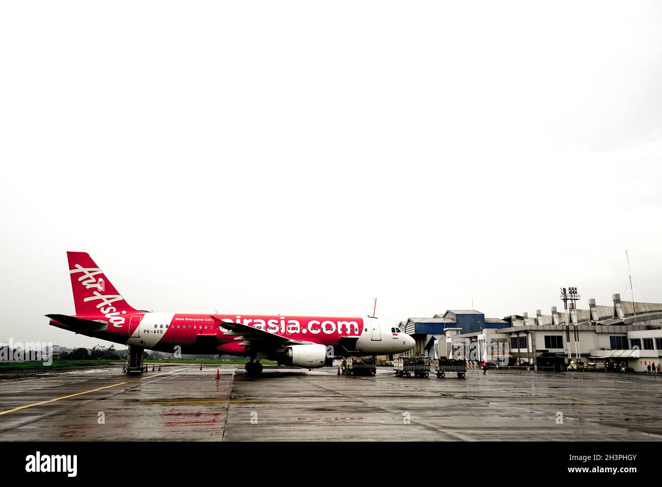 Air Asia Plane parks in Adi Sucipto Airport, Indonesia Stock Photo - Alamy