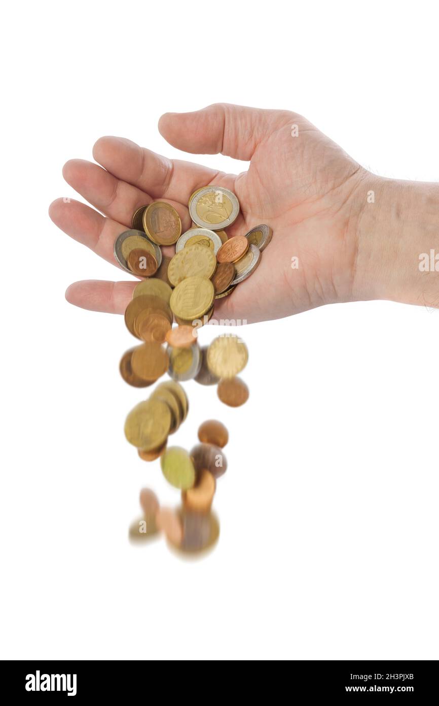 Hand and falling coins Stock Photo - Alamy