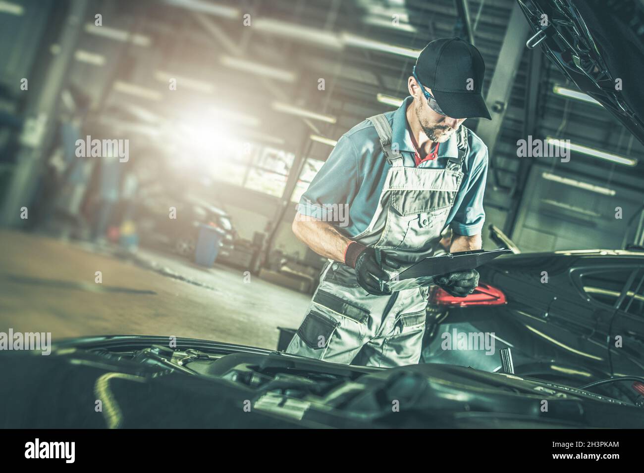Automotive Technician Inside Dealership Car Service Area Performing ...