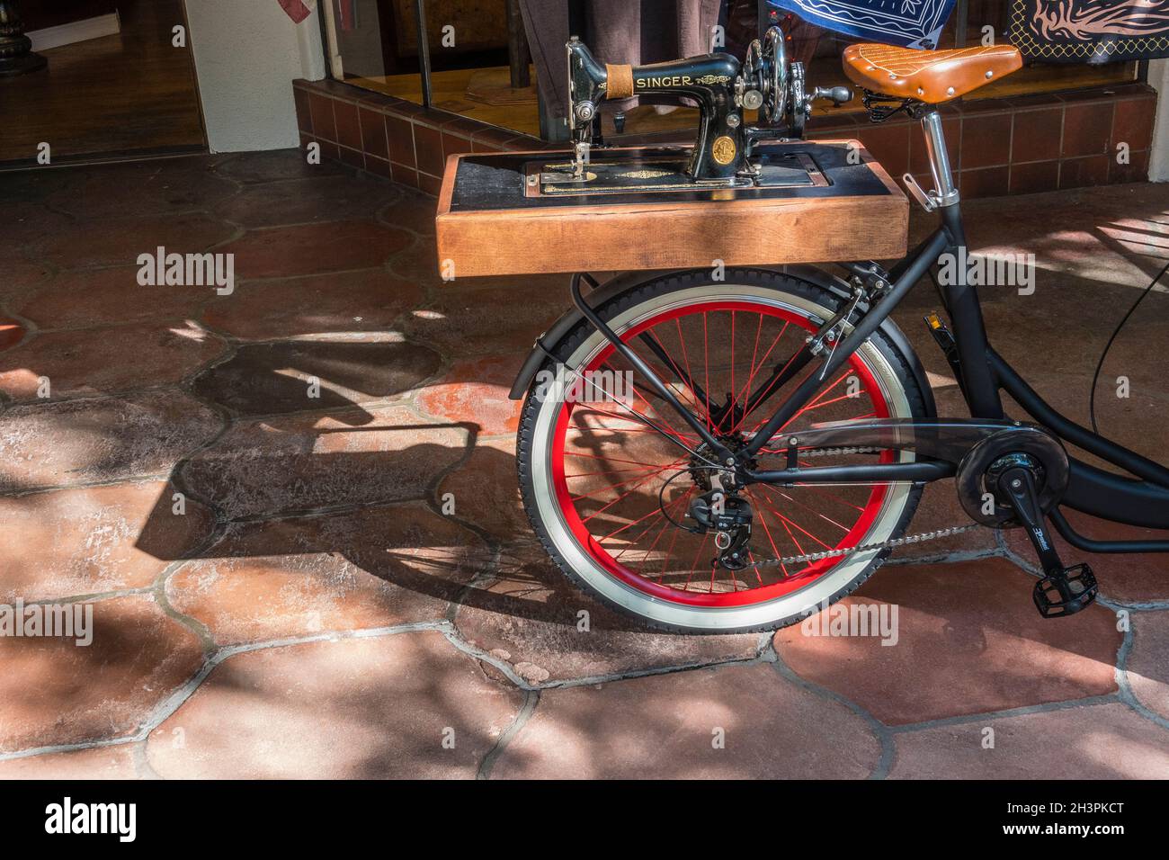 A sewing machine mounted on a bicycle Stock Photo - Alamy