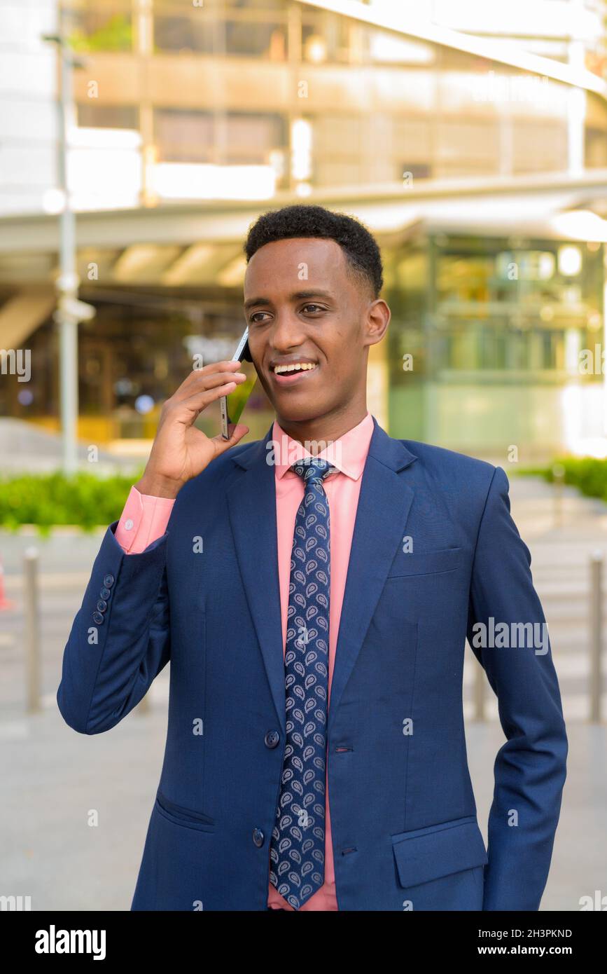 Portrait of young African businessman wearing suit and tie Stock Photo ...