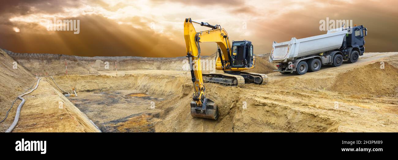 Excavator at work on construction site Stock Photo - Alamy