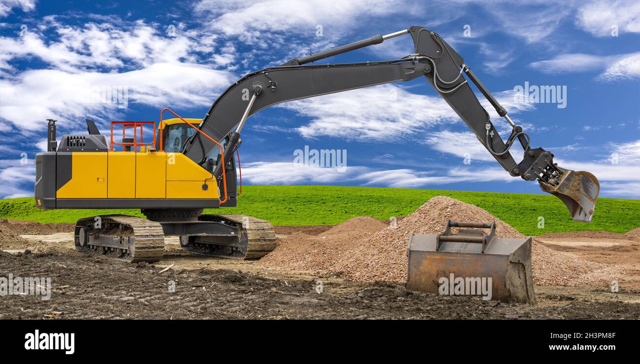 Excavator at work on construction site Stock Photo - Alamy