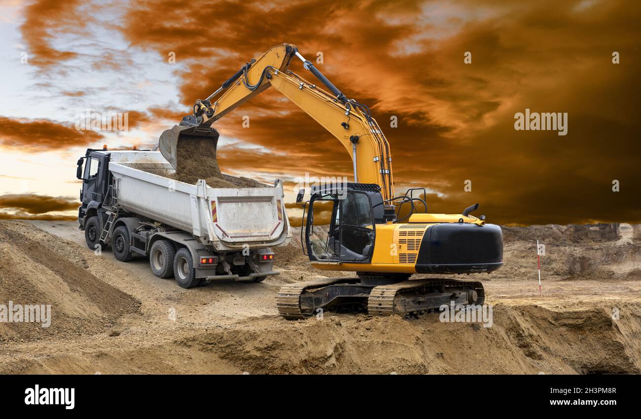 Excavator at work on construction site Stock Photo - Alamy