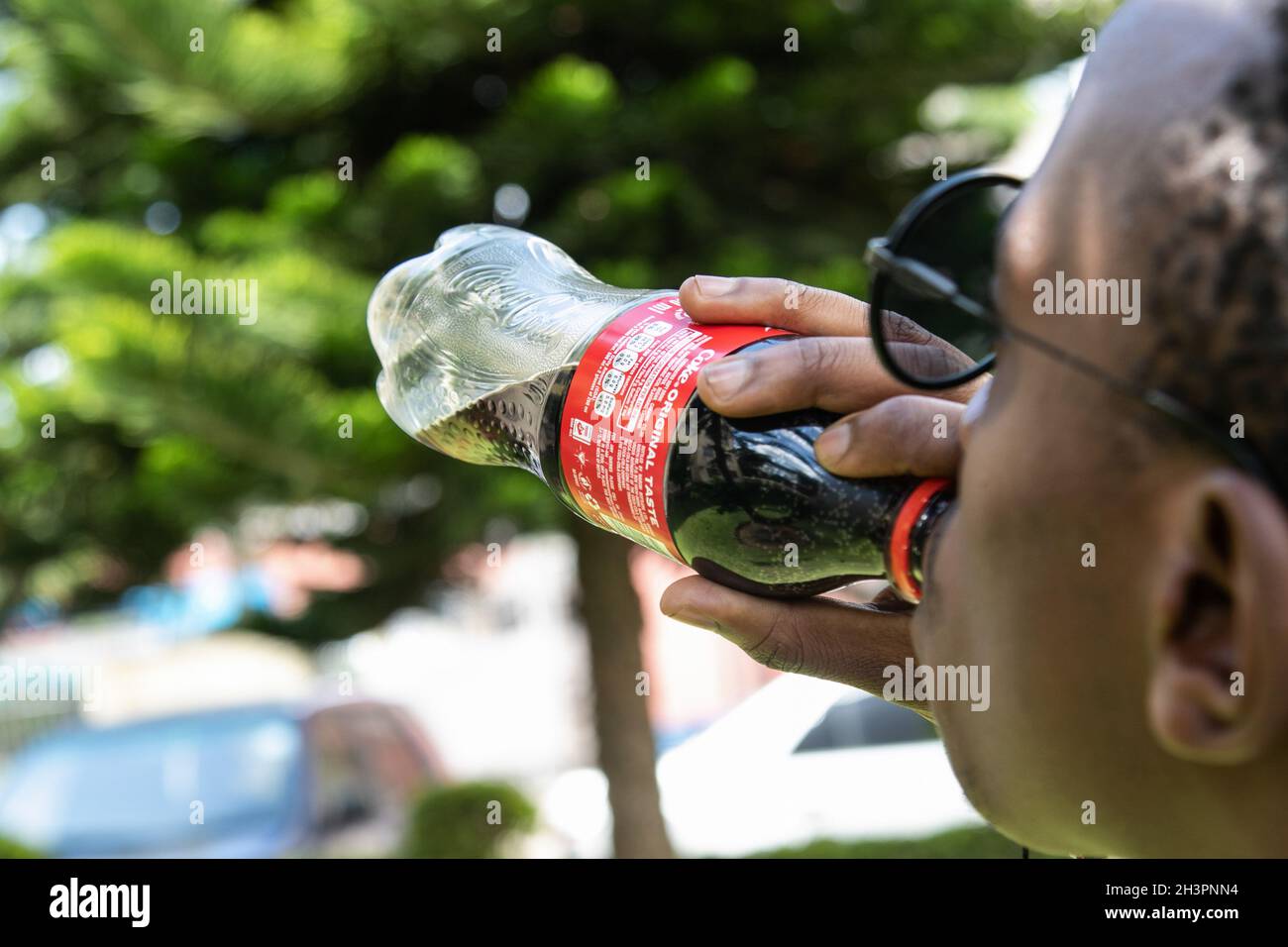 Kenya. 29th Oct, 2021. In this photo illustration a man seen drinking ...