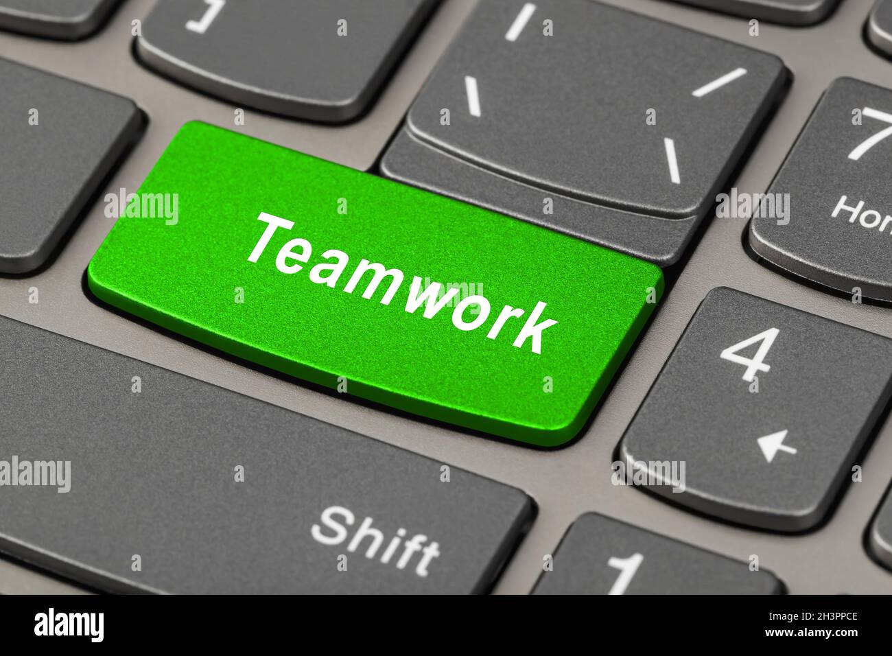 Computer notebook keyboard with Teamwork key Stock Photo - Alamy