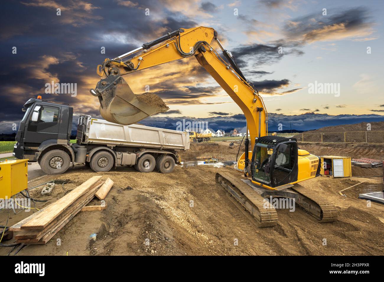 Excavator at work on construction site Stock Photo - Alamy
