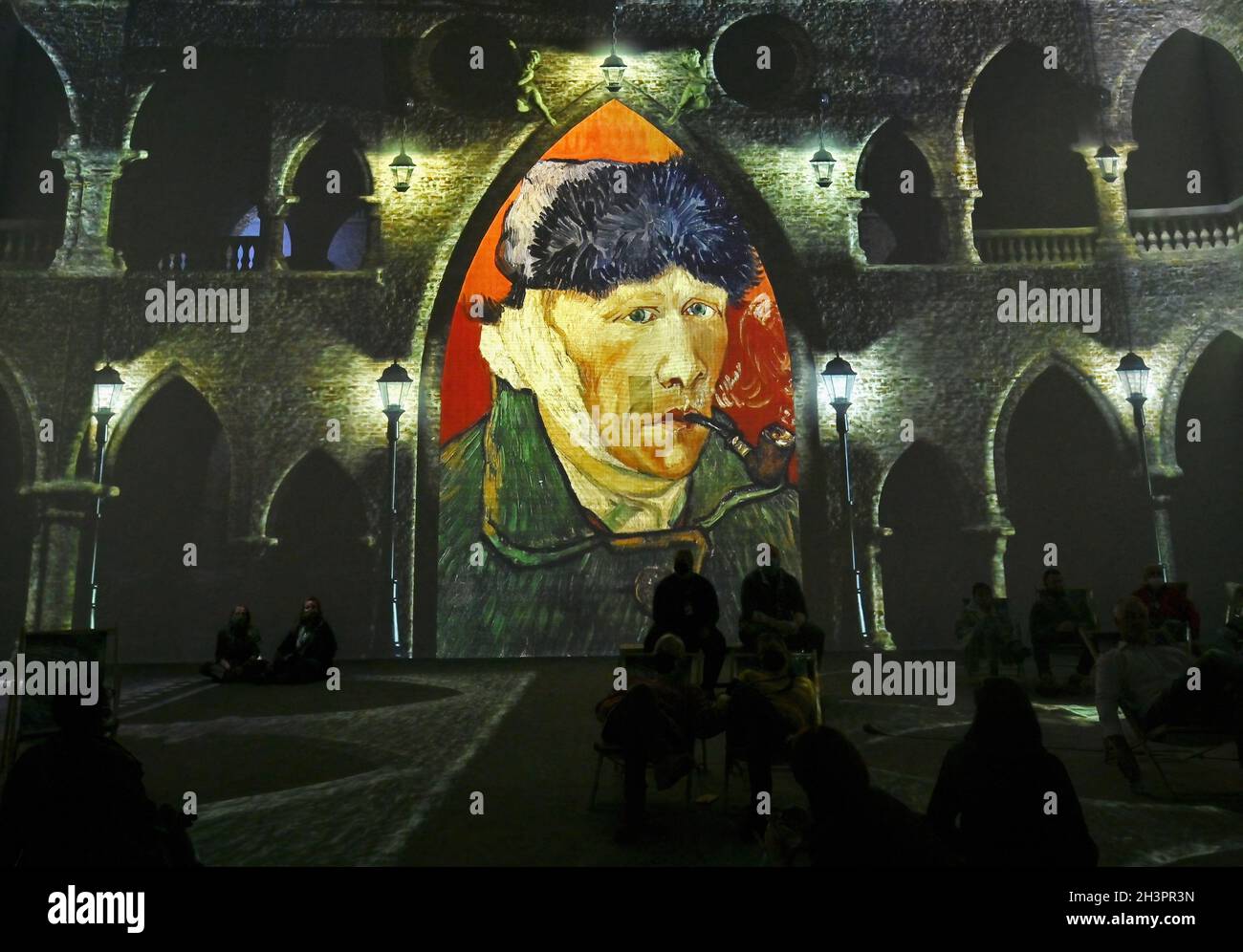 An art image is seen projected on the wall during the show. Van Gogh ...