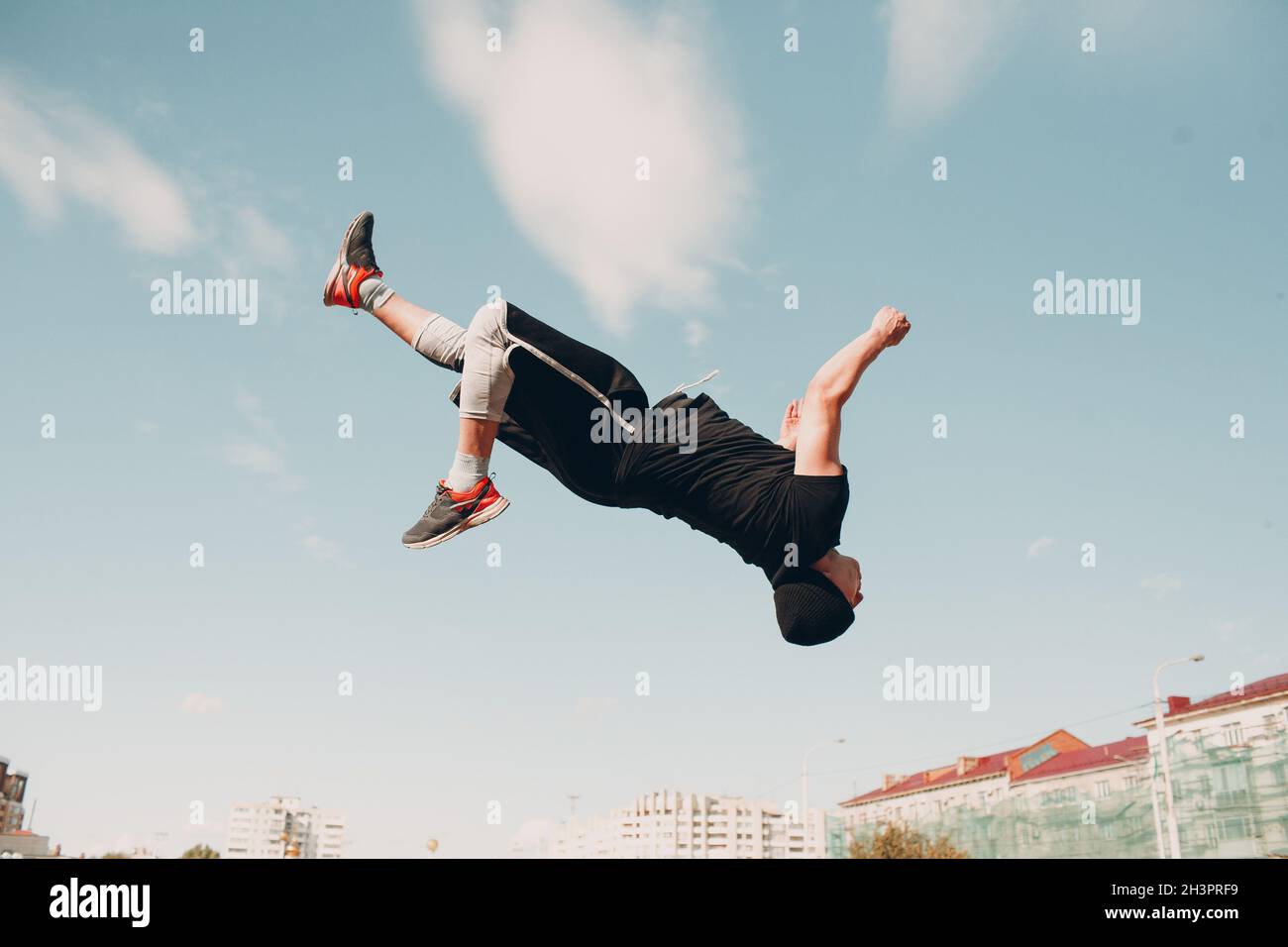 Young sporty guy doing parkour at the city street Stock Photo - Alamy