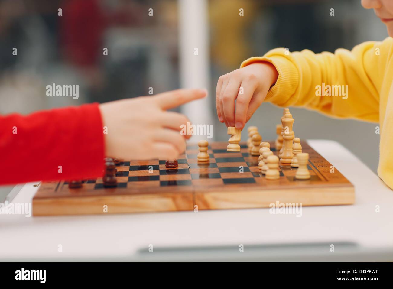 Little kids playing chess at kinder garten or elementary school Stock ...