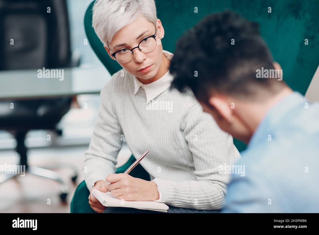 Person sitting on chair interview hi-res stock photography and images ...