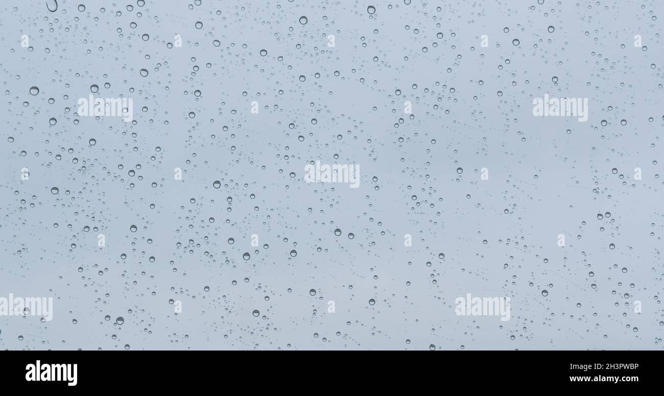 Raindrops sliding on wet glass hi-res stock photography and images - Alamy