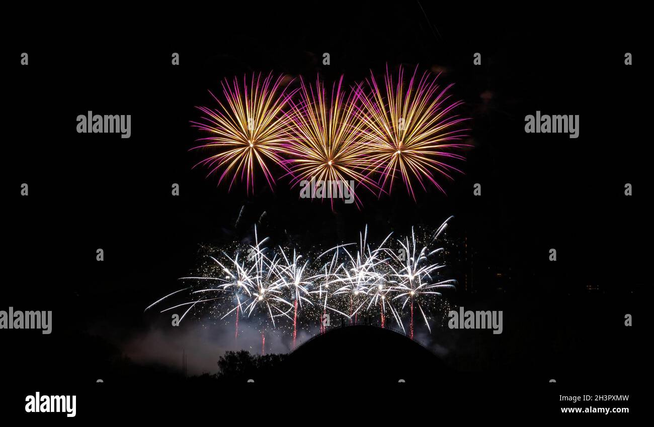 Colorful fireworks display in a dark sky Stock Photo - Alamy