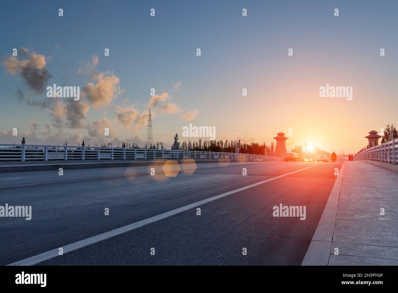 Bridge deck road in sunset Stock Photo - Alamy