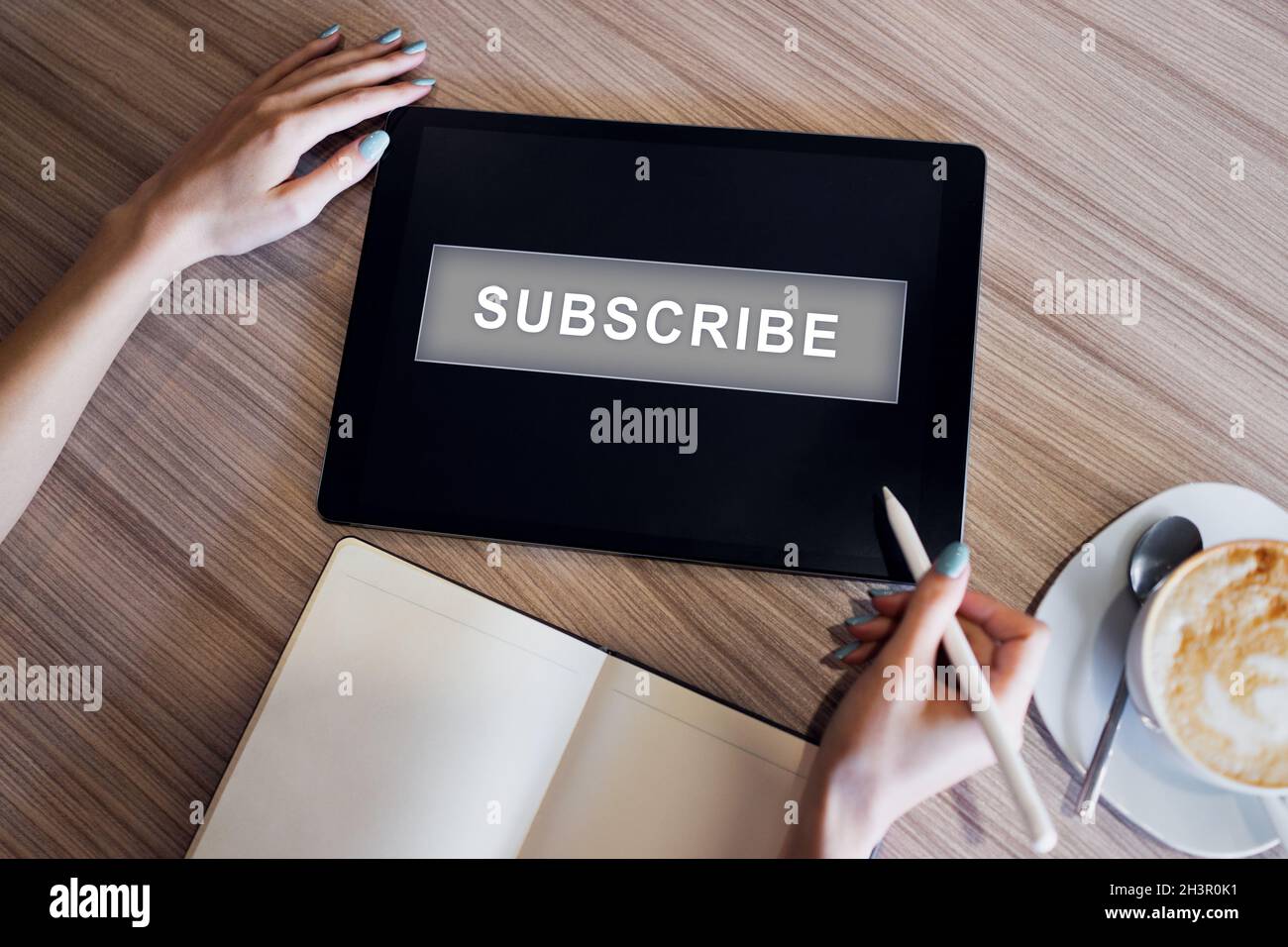 Subscribe button on device screen. Internet and digital marketing ...