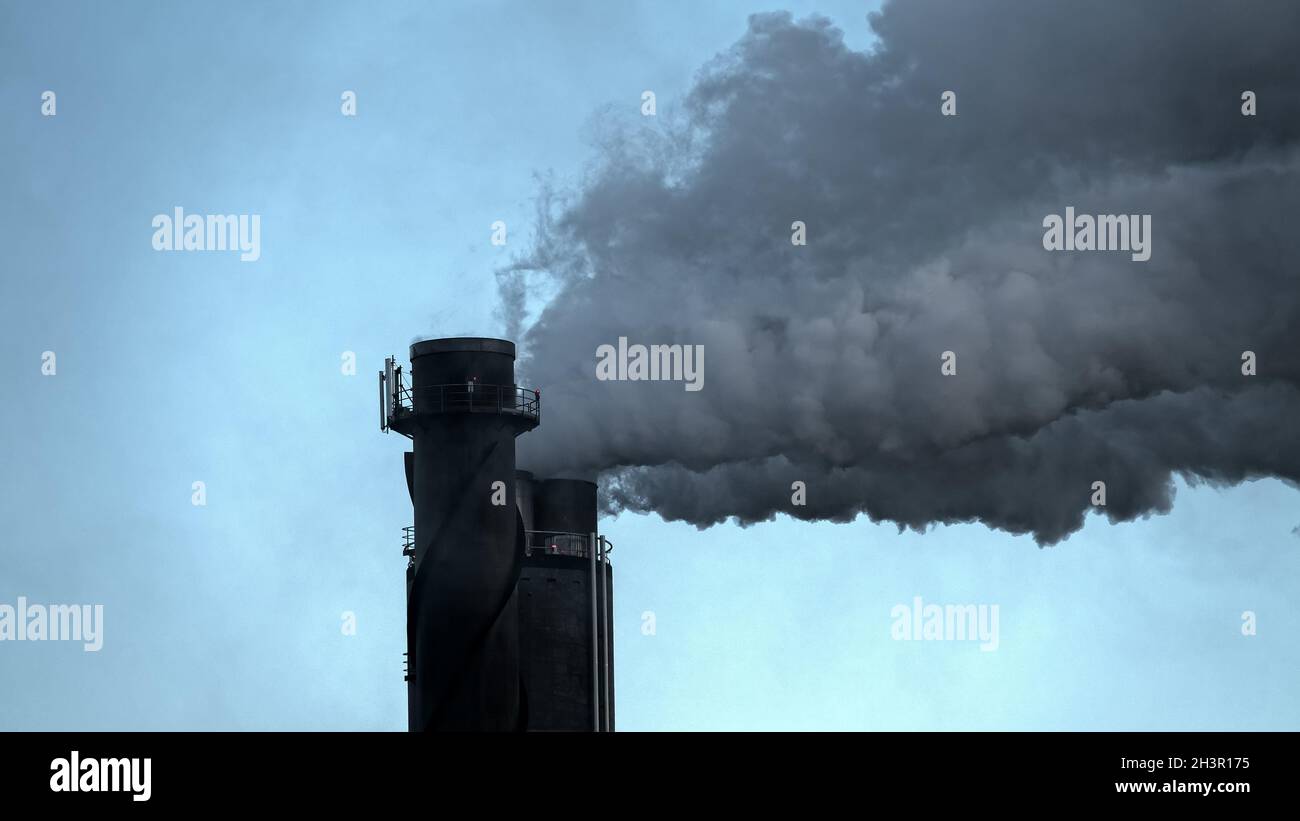 Smoky and steam-emitting pipes Stock Photo - Alamy