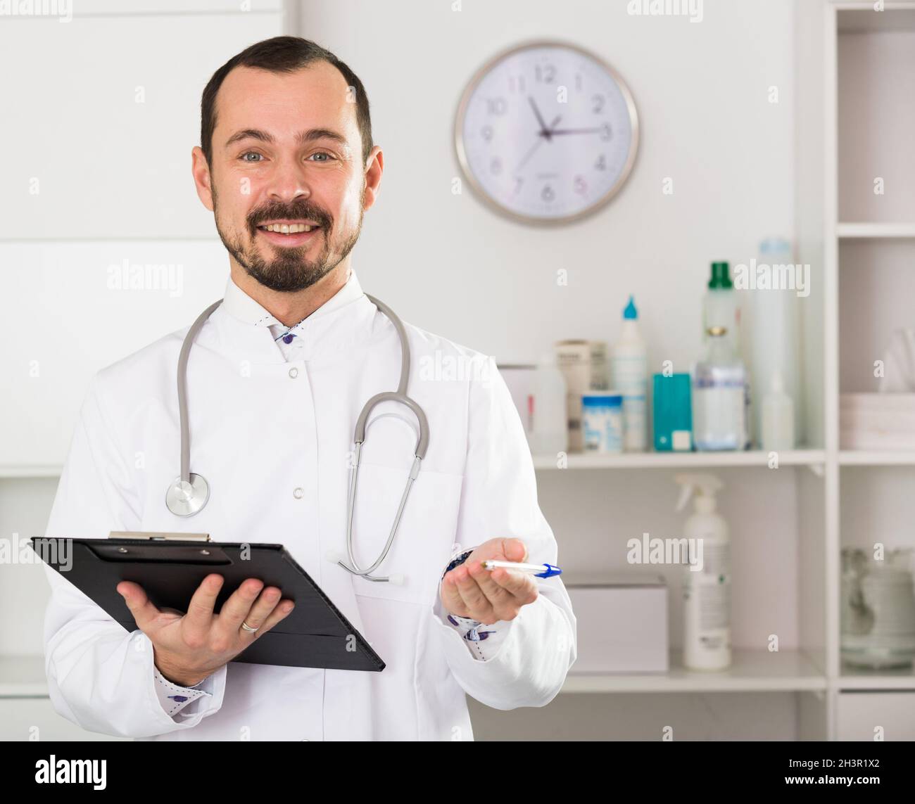 Male doctor waiting for patients Stock Photo - Alamy