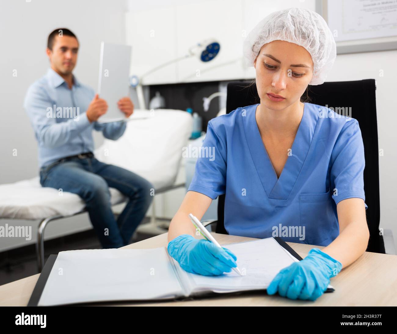 Woman beautician writing notes hi-res stock photography and images - Alamy