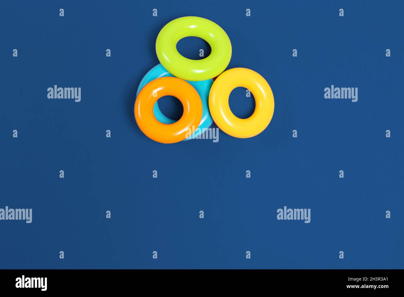 Plastic colorful circles children toys, top view Stock Photo - Alamy