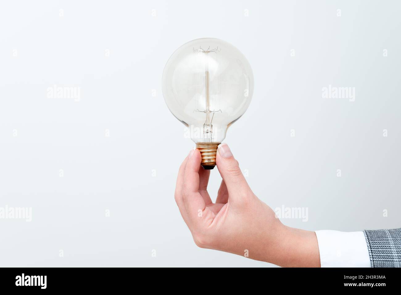 Woman Hand Holding Lamp Presenting Ideas For Project, Man Fists Showing ...
