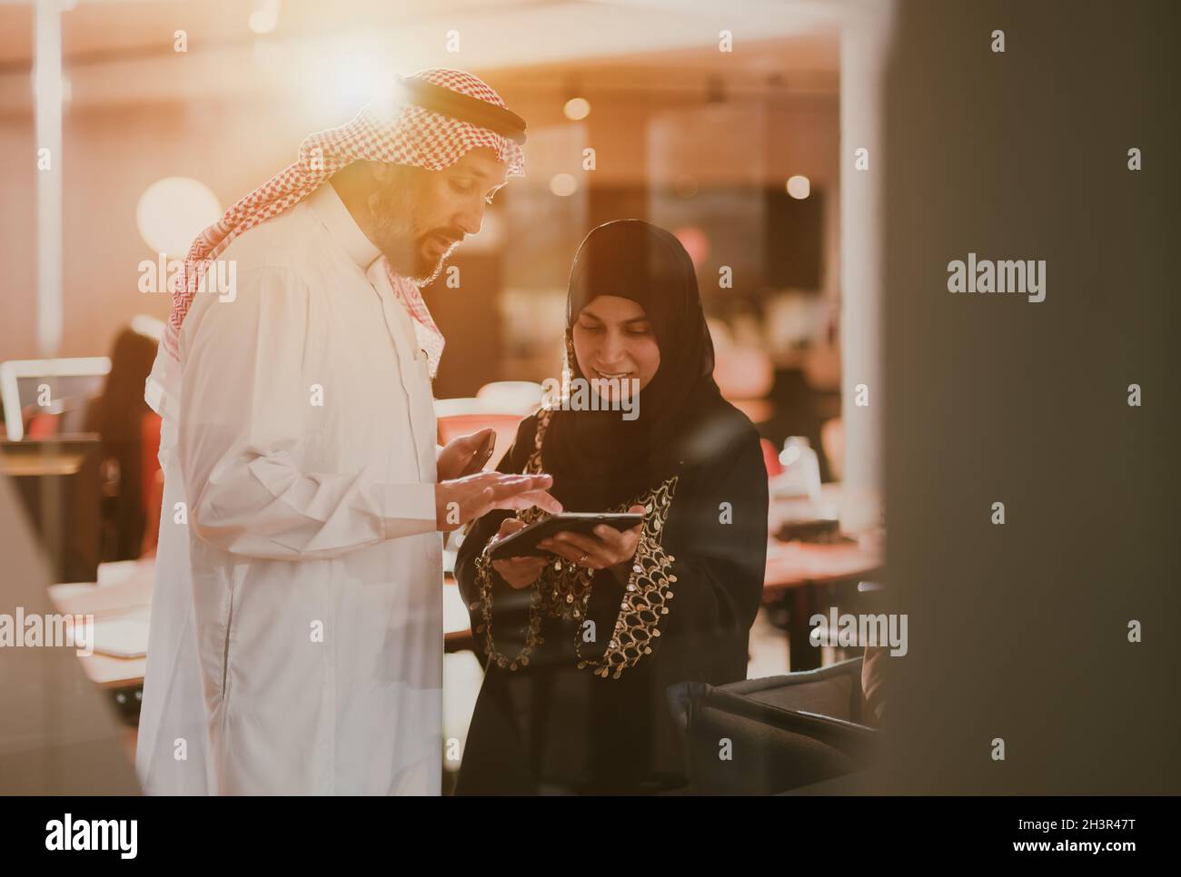 Middle eastern business team in the office working on a tablet computer ...