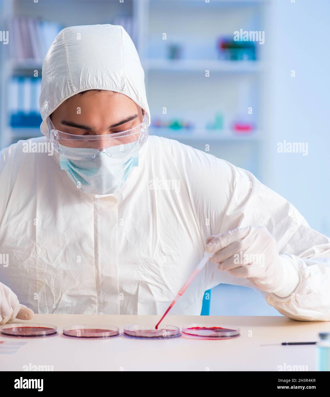 Lab assistant testing blood samples in hospital Stock Photo - Alamy
