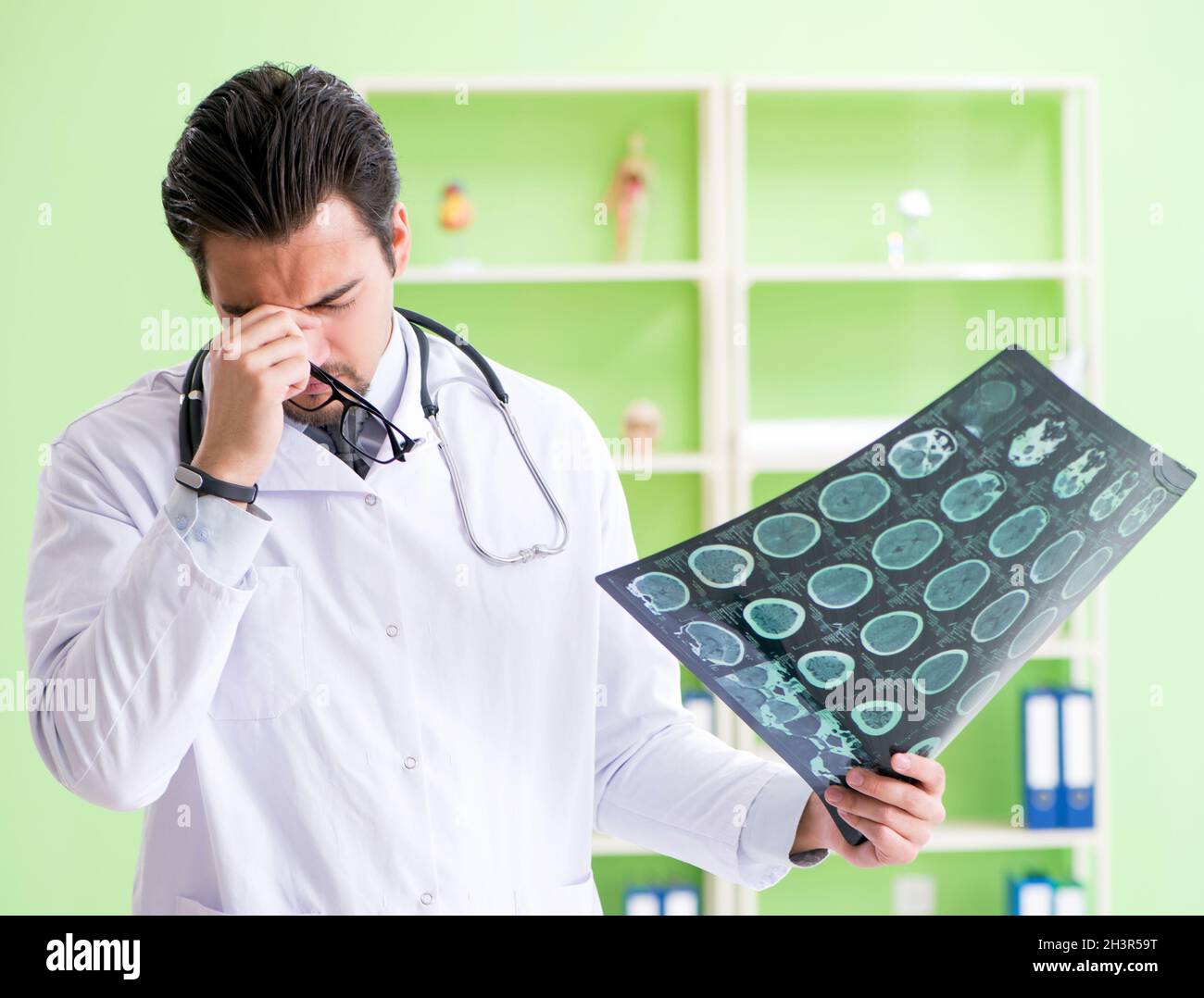 Doctor radiologist looking at x-ray scan in hospital Stock Photo - Alamy