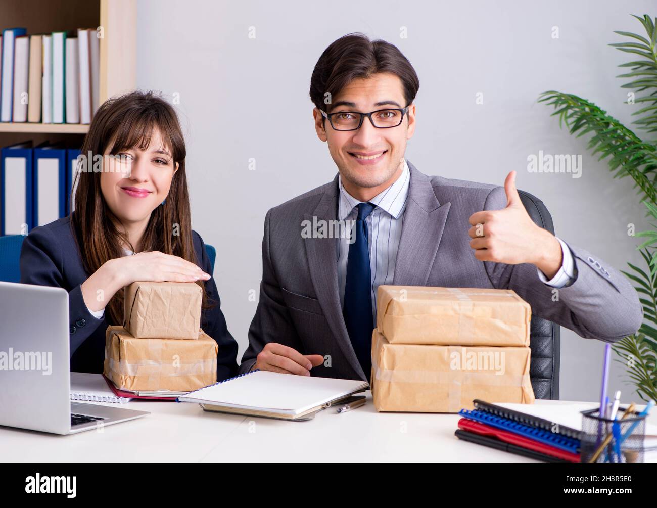 Business people receiving new mail and parcels Stock Photo - Alamy