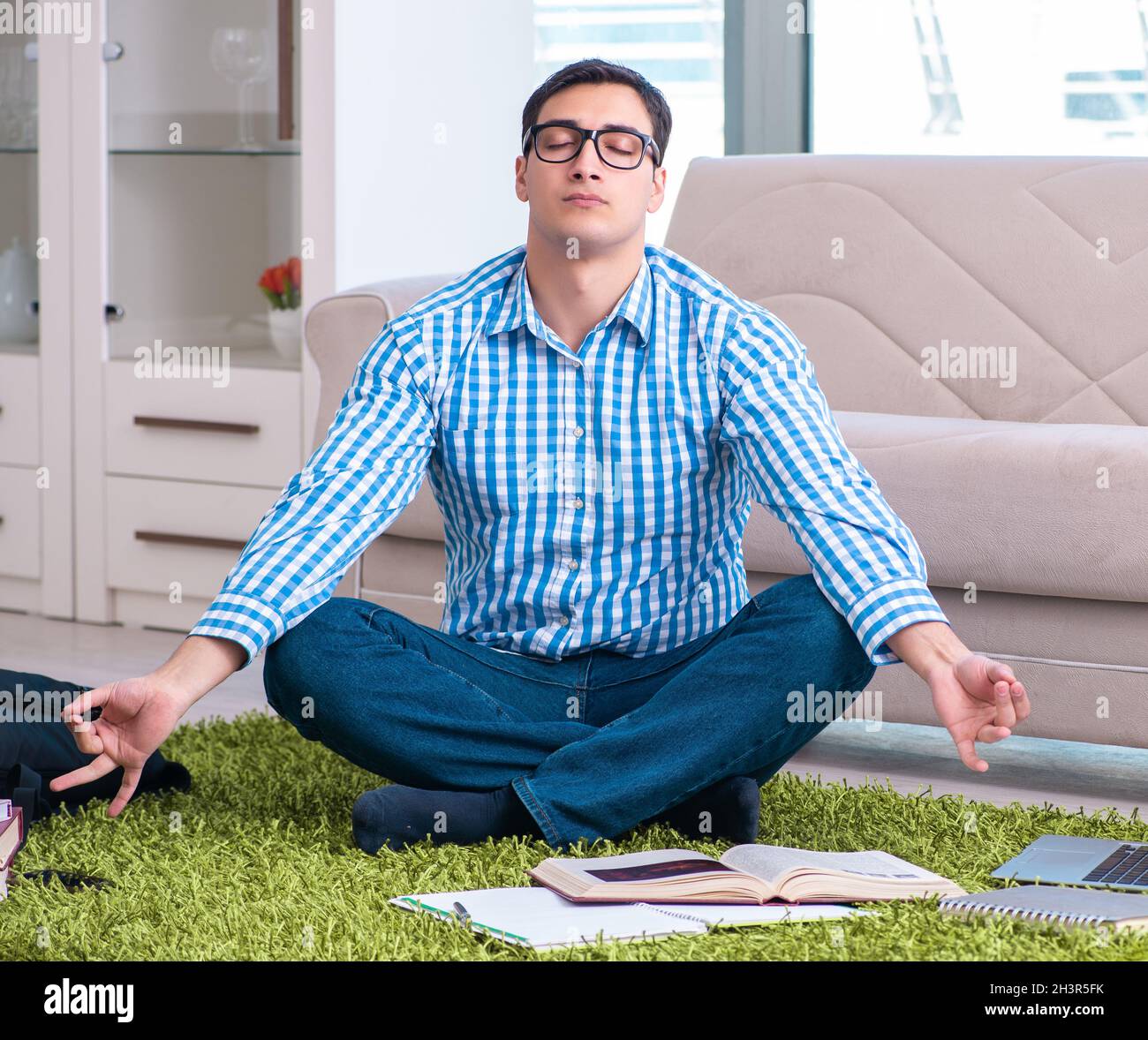 Student meditating and preparing for university exams Stock Photo - Alamy