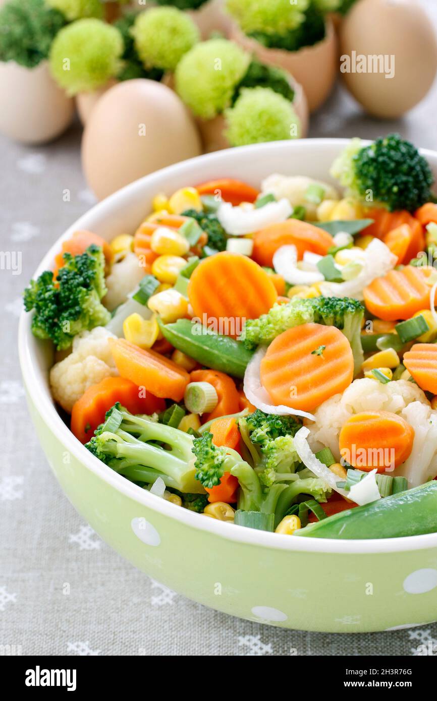 Spring vegetable salad in green dotted bowl. Healthy food Stock Photo ...
