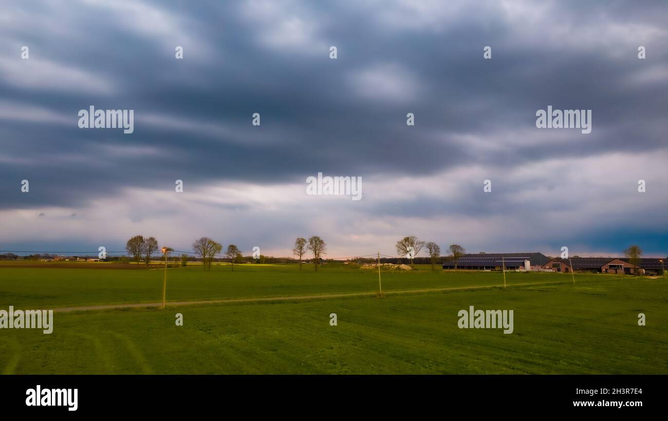 Aerial view of an evening sky over the fields overcast with thunder ...