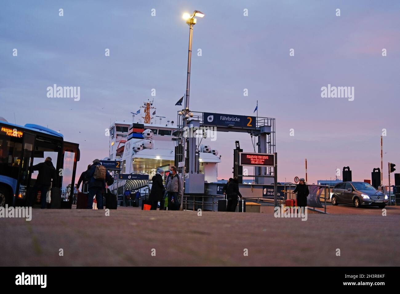 Norddeich, Germany. 30th Oct, 2021. People leave the ferry that arrived ...