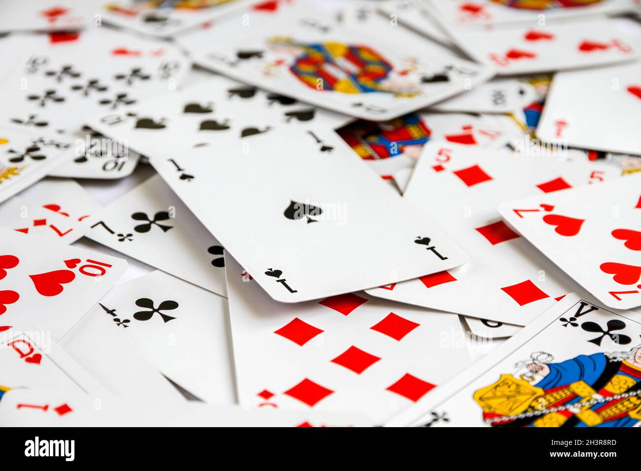 Classic playing card game laid out on a table Stock Photo - Alamy