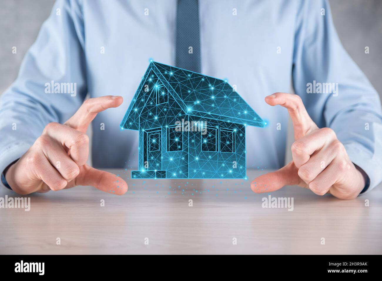 Man hold low polygon.Real estate concept, businessman holding a house ...