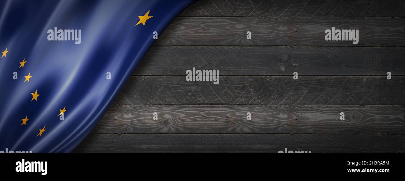 Alaska flag on black wood wall banner, USA Stock Photo - Alamy