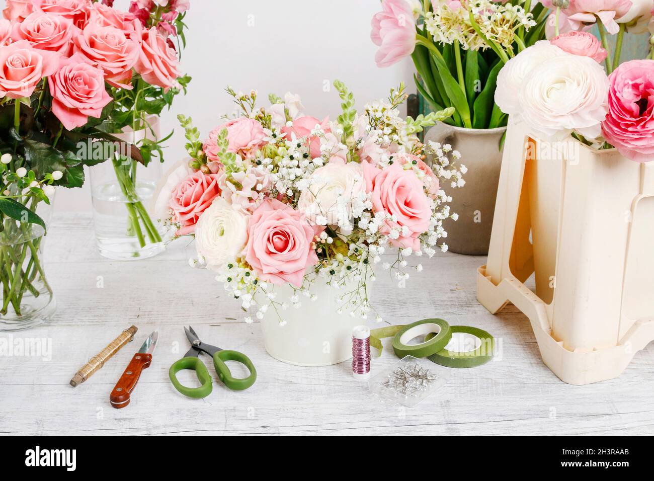 Bouquet of flowers and florist's accessories. Garden hobby Stock Photo ...