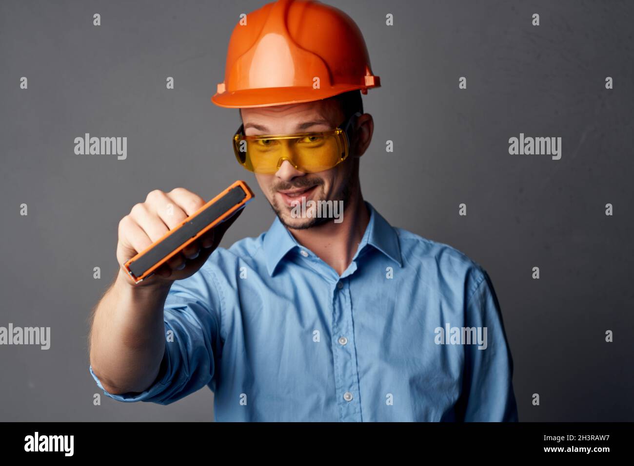 man in construction uniform professional work tools Stock Photo - Alamy