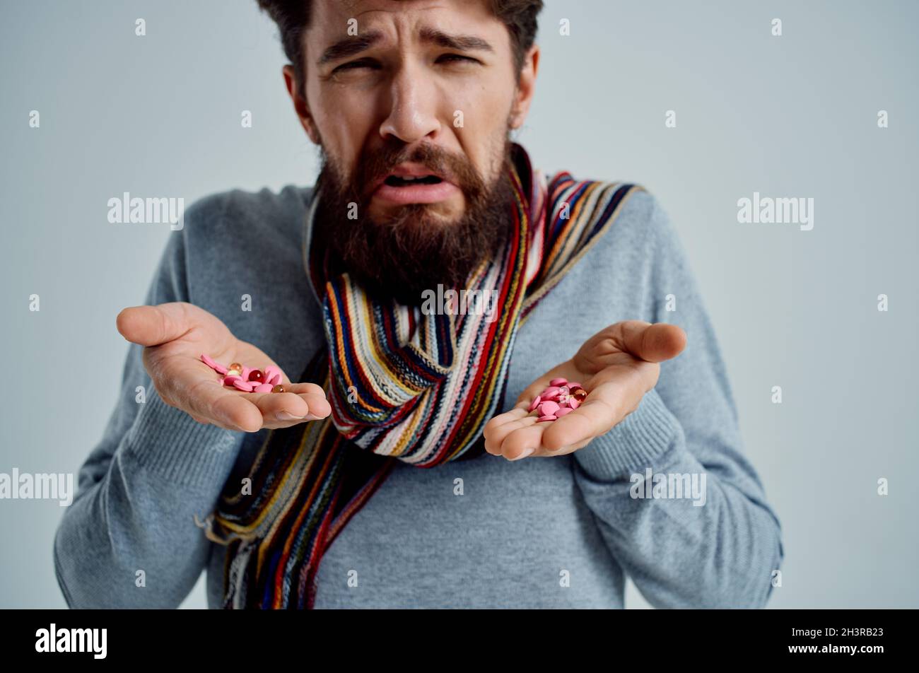 sick man with a scarf around his neck flu health problems light ...