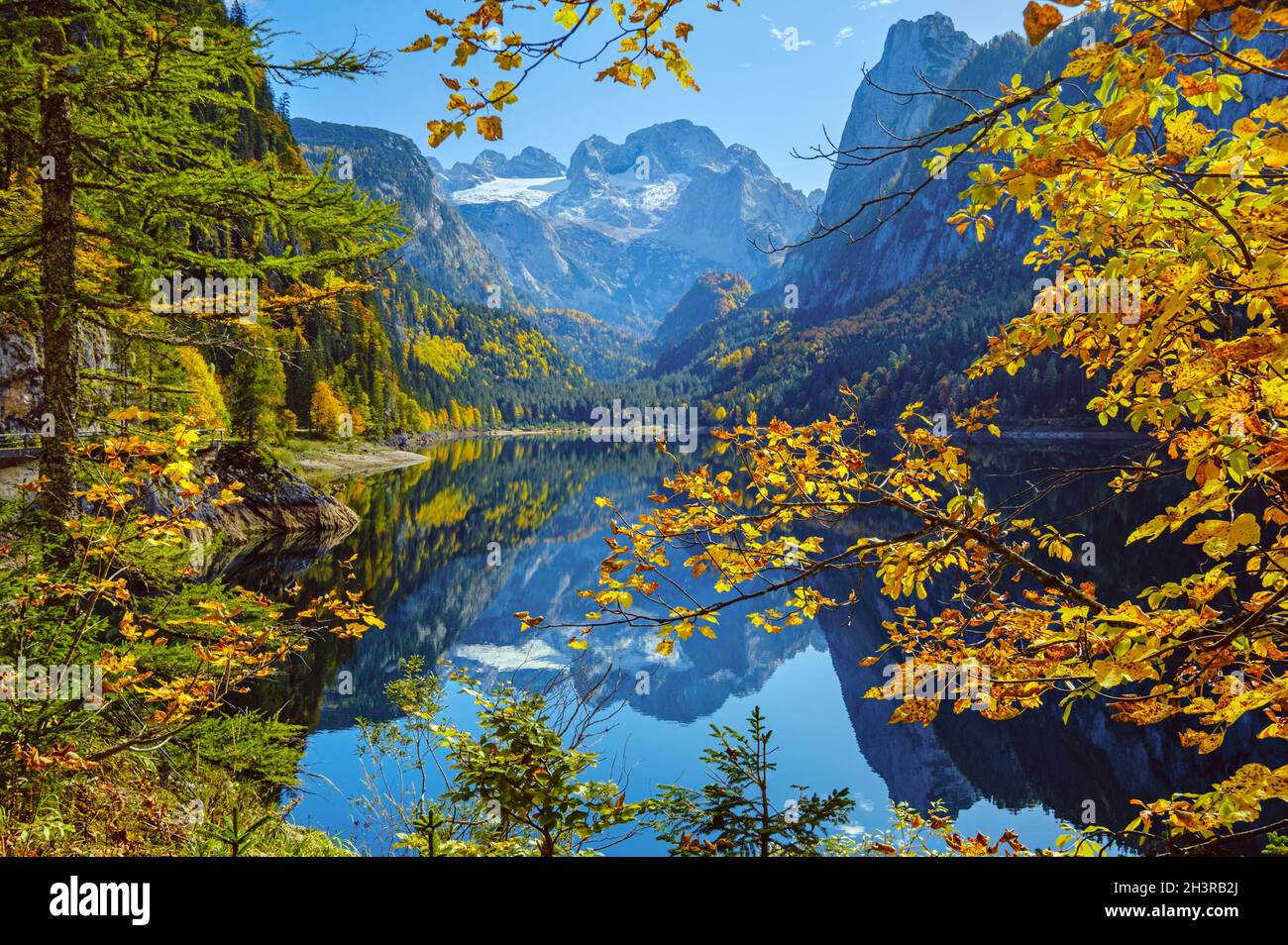 Peaceful autumn Alps mountain lake with reflections. Gosauseen or ...