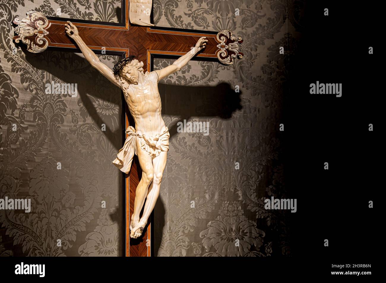 Old crucifix made of wood and ivory. Jesus Christ symbol of ...