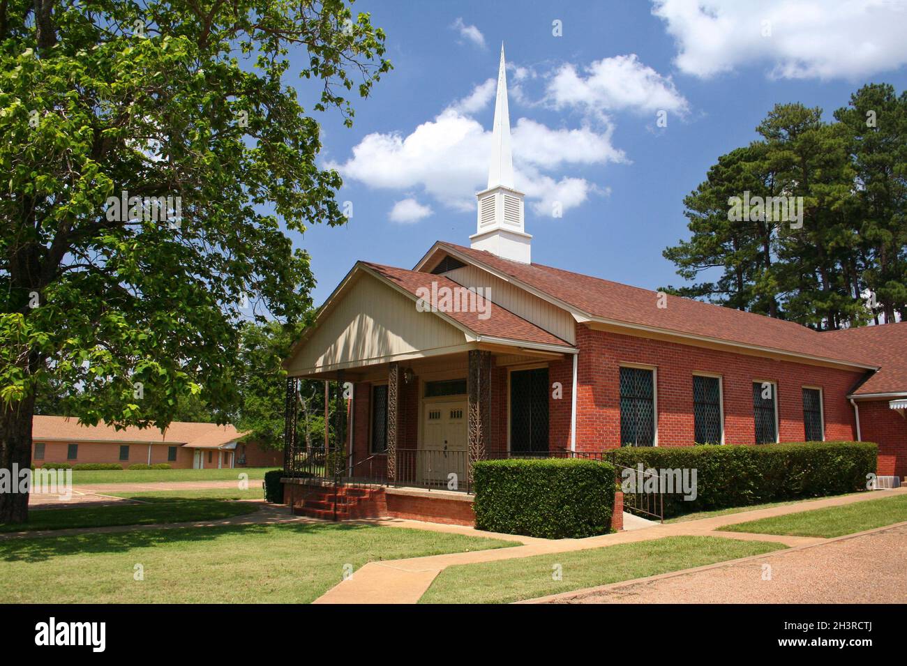 Small Rural Church With Blue Sky and Trees Stock Photo - Alamy