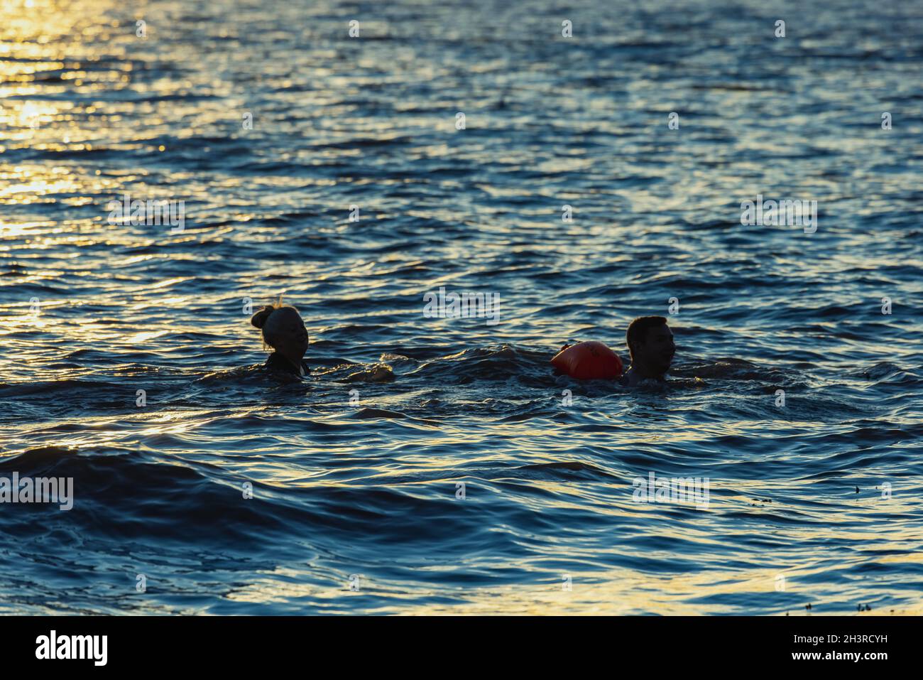 Going in for a dip off Clevedon beach Stock Photo - Alamy