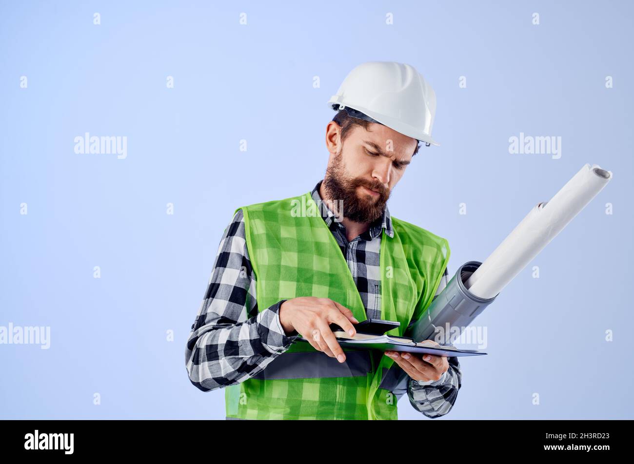 engineer with documents and drawings blueprints isolated background ...